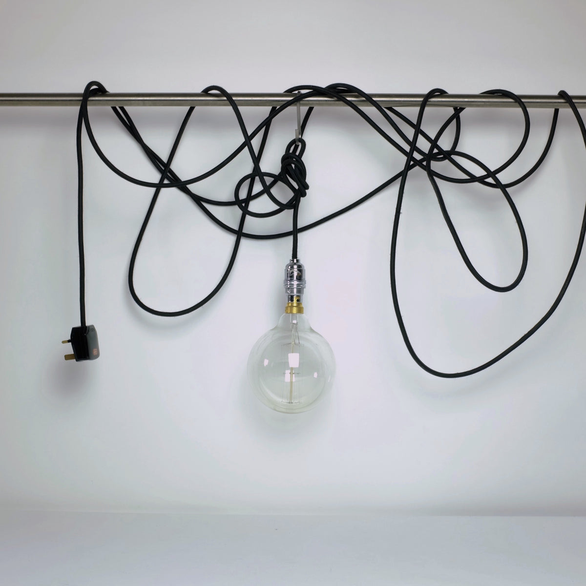 Long black cable hanging light – The Prop Bank